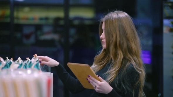 Girl Selecting Products From The List, Stock Footage | VideoHive