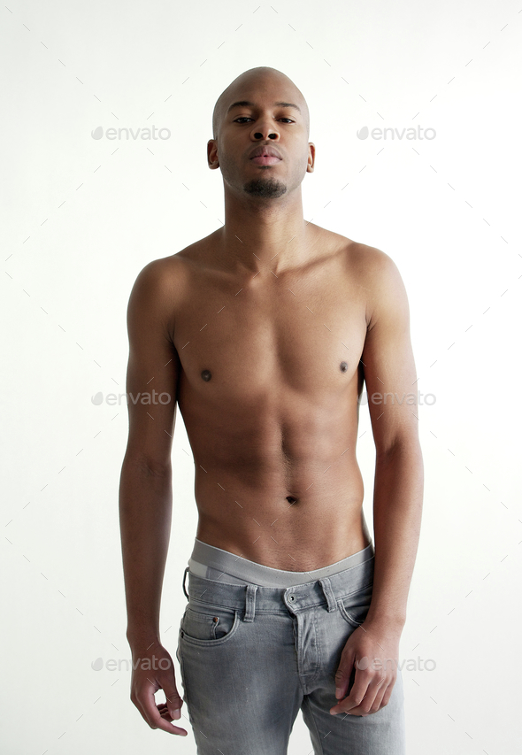 Attractive male model standing on white background Stock Photo by ...