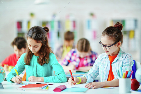 Learning at school Stock Photo by Pressmaster | PhotoDune