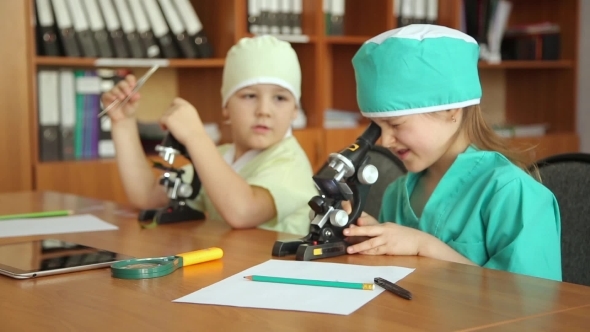 Children Play With a Microscope, Stock Footage | VideoHive