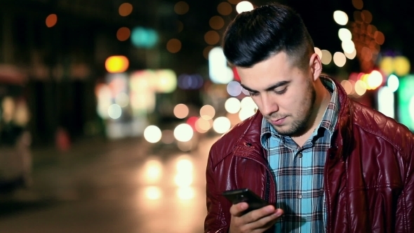Handsome Young Man Talking On Smartphone Smiling Happy, Stock Footage