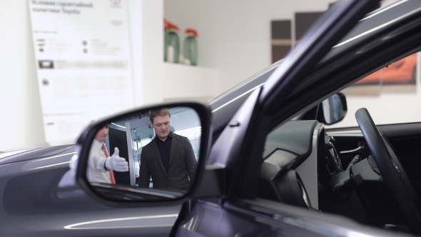 Image Of Car Dealer With Client Preparing To Test Drive, Stock Footage