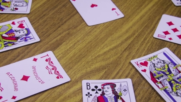 Playing Cards Rotates On a Wooden Table, Stock Footage | VideoHive