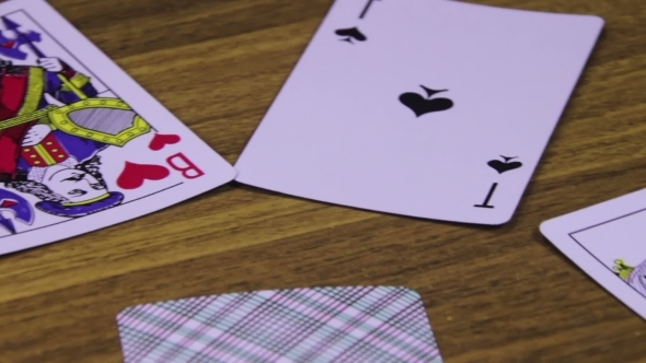 Playing Cards Rotates On a Wooden Table, Stock Footage | VideoHive
