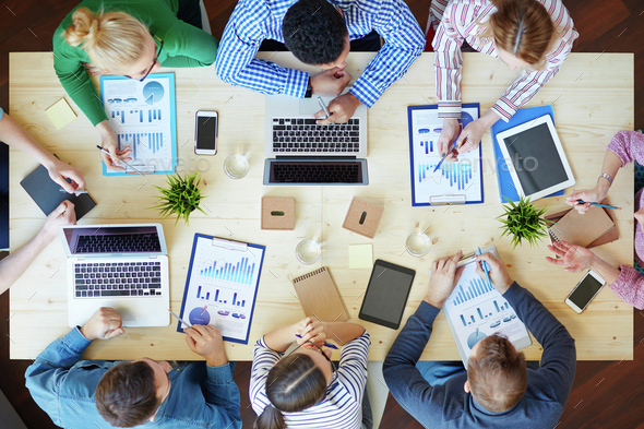 Working in team Stock Photo by Pressmaster | PhotoDune