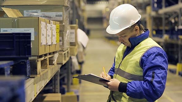Worker on Warehouse Checking Cargo, Stock Footage | VideoHive