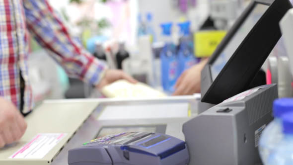 Man Standing Behind the Cash Register at the Store, Stock Footage
