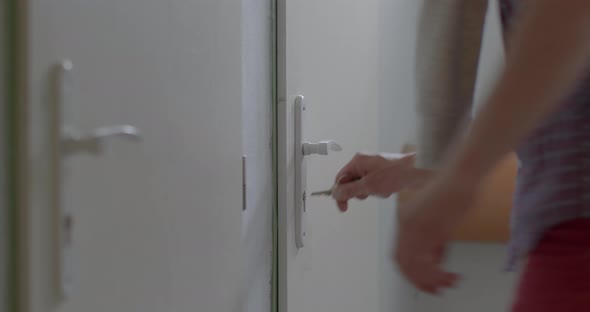 Using the Lock on the Door Man Opens Lock Gets Distracted and Leaves ...