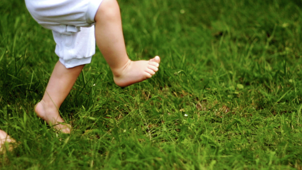 Baby Boy Walking his First Steps with his Mothers Support, Stock Footage