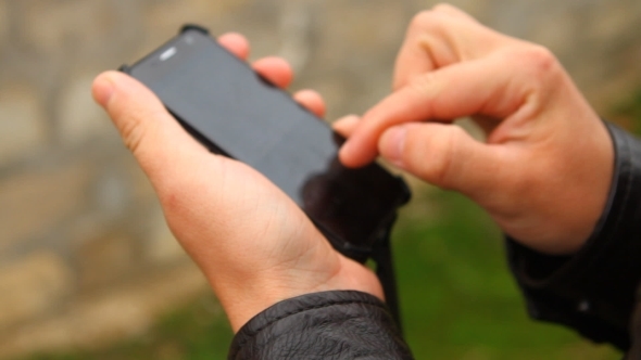 Man Opens Case Smartphone And Uses It, Stock Footage | VideoHive
