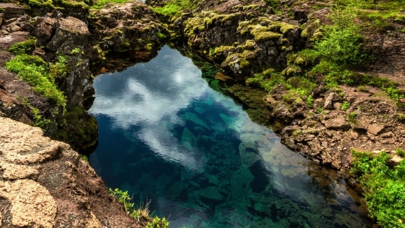 Plate Tectonic Rifting Filled With Clear Water. Reflection of Clouds ...