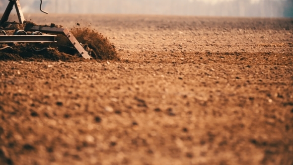 Tractor Plowing Field At Sunset, Stock Footage | VideoHive