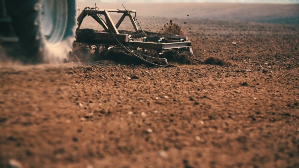 Tractor Plowing Field At Sunset, Stock Footage | VideoHive