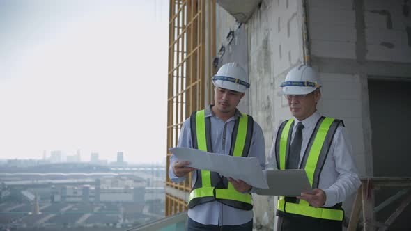 Engineer concept. Business people lay out building plans, Stock Footage