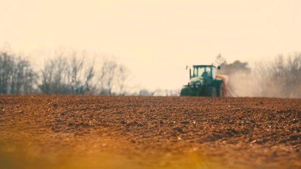 Tractor Plowing Field At Sunset, Stock Footage | VideoHive