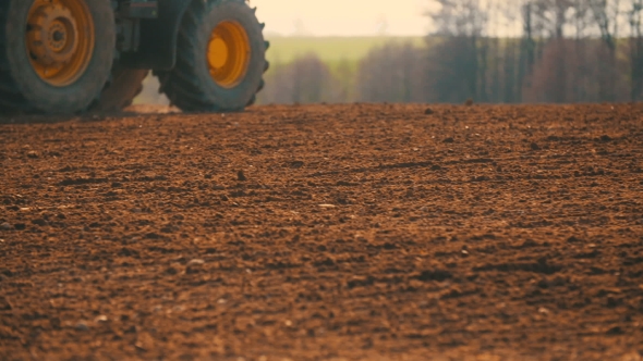 Tractor Plowing Field At Sunset, Stock Footage | VideoHive
