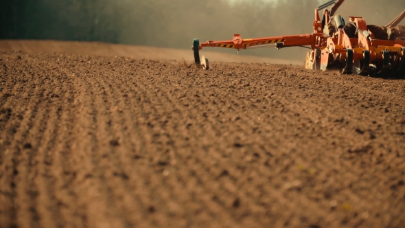 Tractor Plowing Field At Sunset, Stock Footage | VideoHive