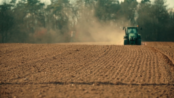 Tractor Plowing Field At Sunset, Stock Footage | VideoHive