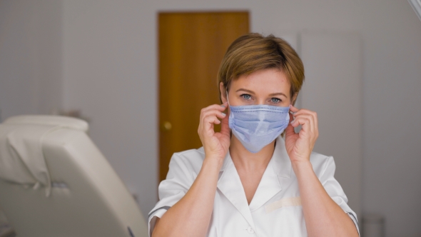 Doctor / Nurse Smiling Behind Surgeon Mask. , Stock Footage | VideoHive