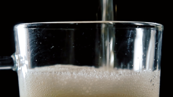Fresh, Cold, Crisp Beer Being Poured Into a Classic Pint Mug Against a ...