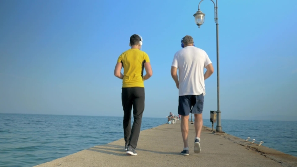 Men Exercising By Walking Backward Along The Pier, Stock Footage ...