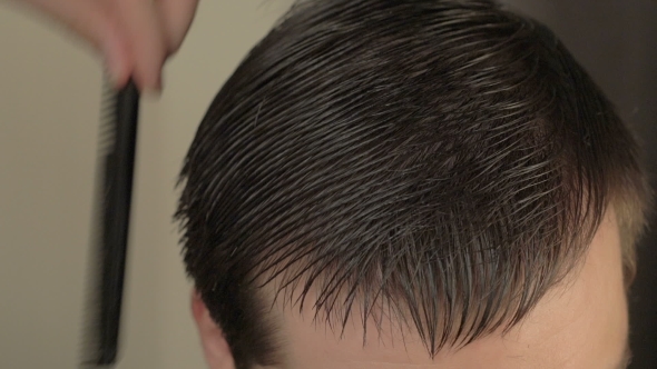 Hair Dresser Combing Client's Hair In Salon, Stock Footage | VideoHive