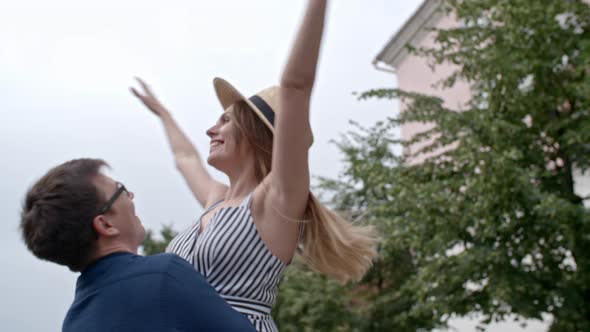 Man Spinning Around His Girlfriend Outdoors, Stock Footage | VideoHive