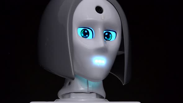 Rbot Speaks in a Dark Room. Black Background. Close Up, Stock Footage