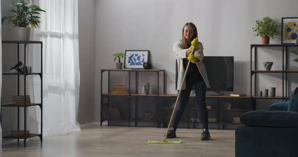 Female Housekeeper Is Dancing with Mop During Cleaning Home Washing ...
