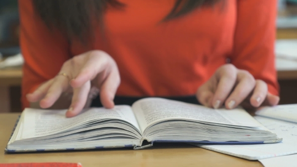 Young Girl Sits And Flips Through a Book Tutorial, Stock Footage ...