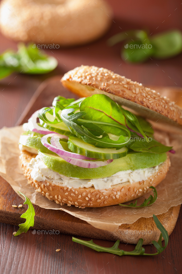 avocado sandwich on bagel with cream cheese onion cucumber arugu Stock ...