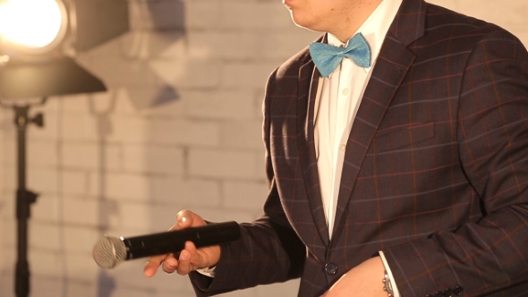 Man Throws The Microphone From Hand To Hand, Stock Footage | VideoHive