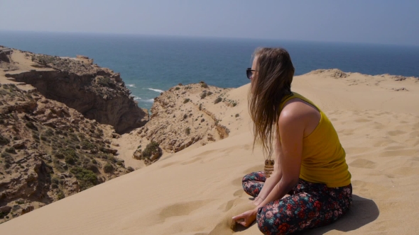 Sand Falling From Woman's Hands In Sand Dune Near Seashore, Stock Footage