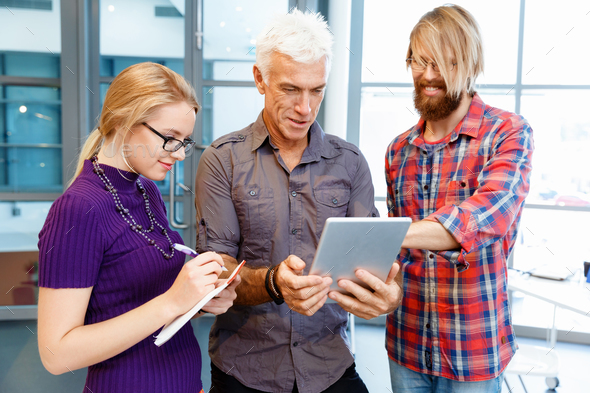 Co-workers working together Stock Photo by nexusplexus | PhotoDune