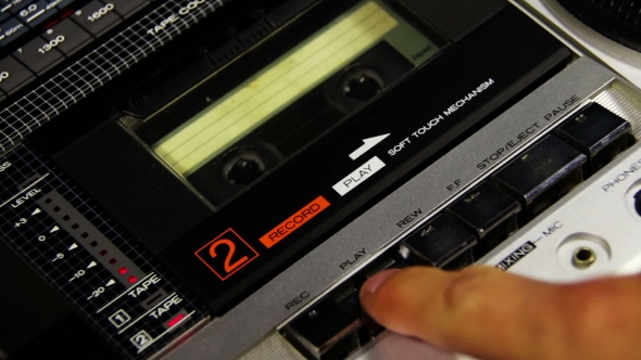 Pressing a Finger Play And Stop Button On a Tape Recorder, Stock Footage