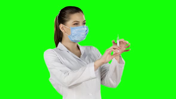 Young Doctor with Injection. Green Screen. Closeup, Stock Footage ...