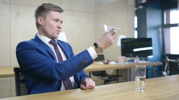 Businessman Holding Paper Plane, Thinking an Idea, Stock Footage ...