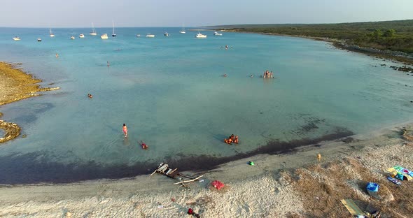 Tourists Enjoying On Beautiful Slatinica Beach At Olib Island, Croatia ...