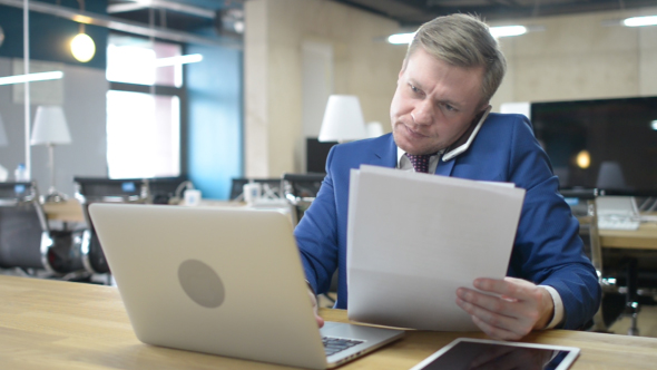 Work Overload w/ Laptop, Phone Call, Documents, Stock Footage | VideoHive