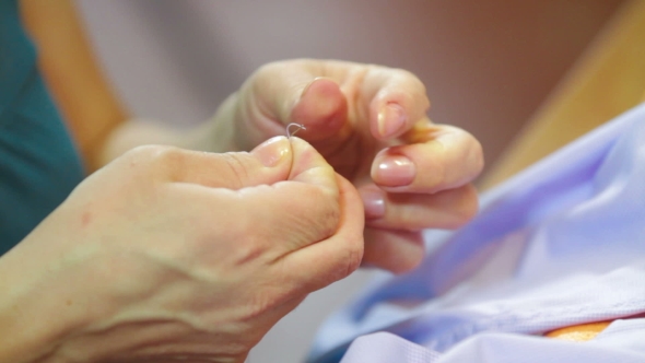 Tailor Sewing Button On Shirt , Stock Footage | VideoHive