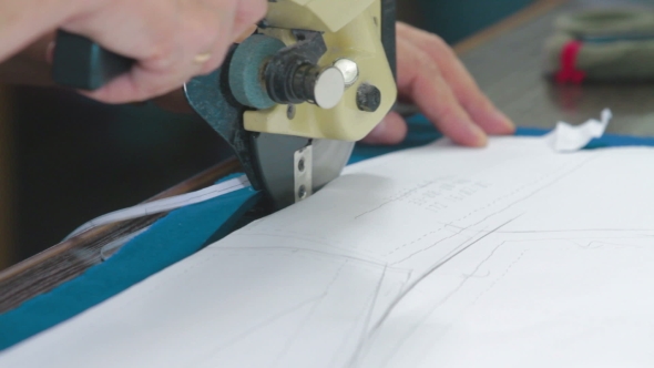 Tailor Cutting The Patterns With Electric Saw, Stock Footage | VideoHive