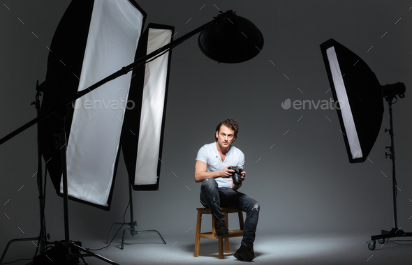 Man photograph sitting on the chair in professinal studio Stock Photo ...