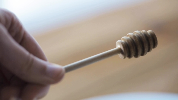 Hand Holding Dipper With Pouring Honey 2, Stock Footage | VideoHive