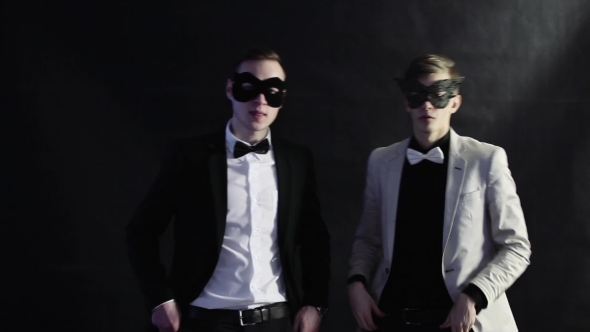 Two Guys'm Posing On a Black Background, Stock Footage | VideoHive