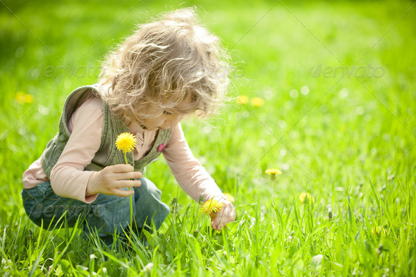 Beautiful child picks flowers Stock Photo by Sunny_studio | PhotoDune