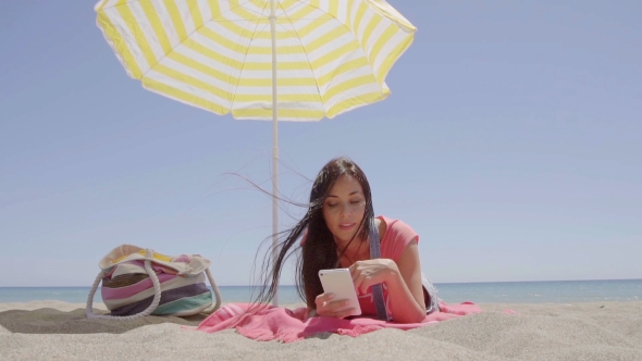 Ground Level View Of Woman Using Phone At Beach, Stock Footage | VideoHive