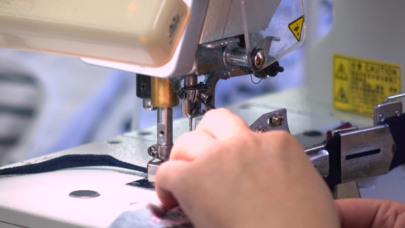 Factory Seamstress At Work And Industrial Sewing Machine , Stock Footage