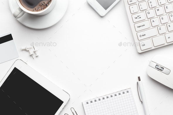 Overhead Of White Office Table With Copy Space Stock Photo by garloon