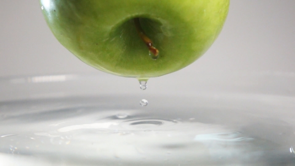 Drop Of Water Falling Down From Apple Into Water, Stock Footage | VideoHive