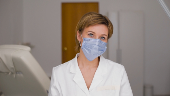 Doctor / Nurse Smiling Behind Surgeon Mask. , Stock Footage | VideoHive